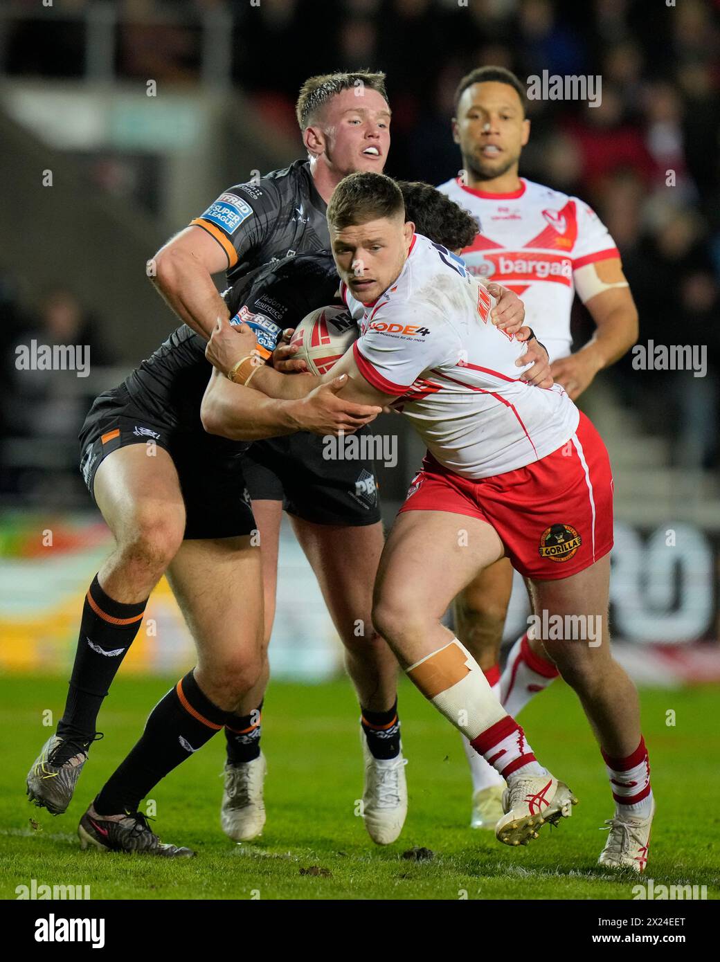 Morgan Knowles of St. Helens runs through the Hull FC defence during ...