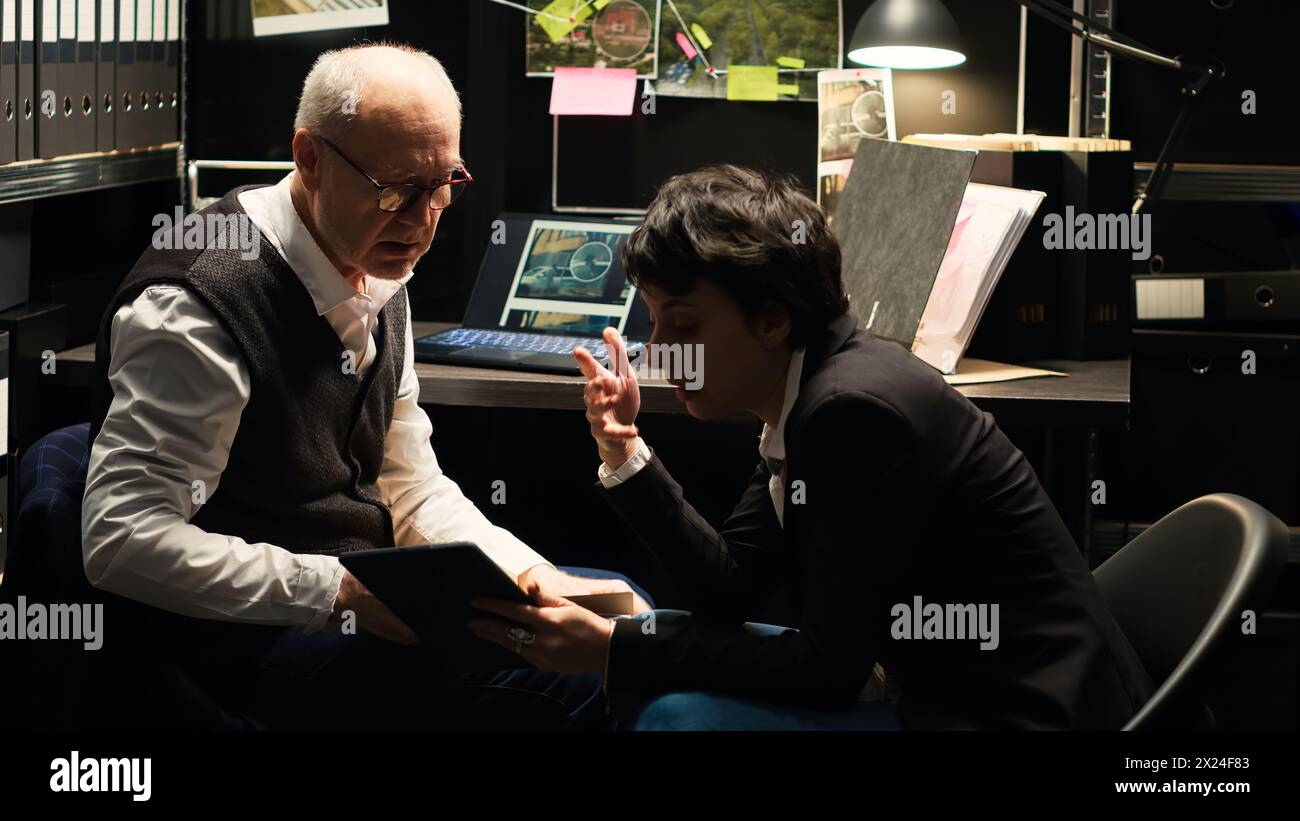 Partners reviewing classified documents to uncover new clues and piece ...