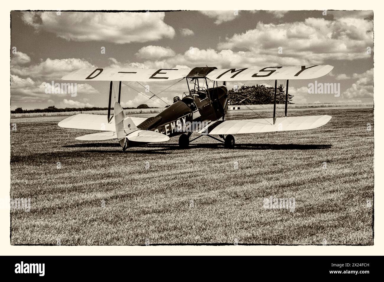 G-EMSY 1930s De Havilland Gypsy Major aircraft taxiing down the grass ...