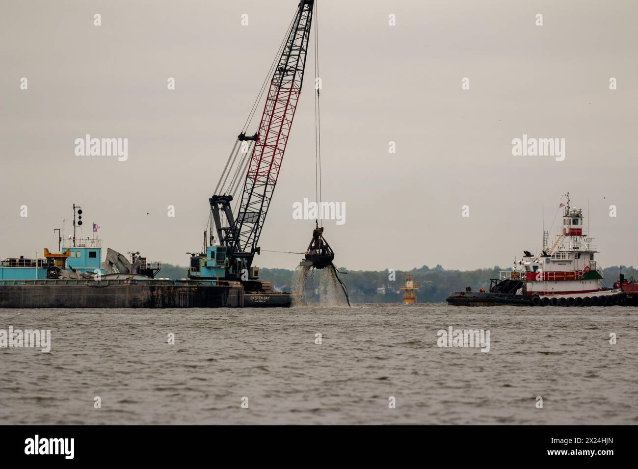 Members of the U.S. Coast Guard deploy buoys marking the Fort Carroll ...