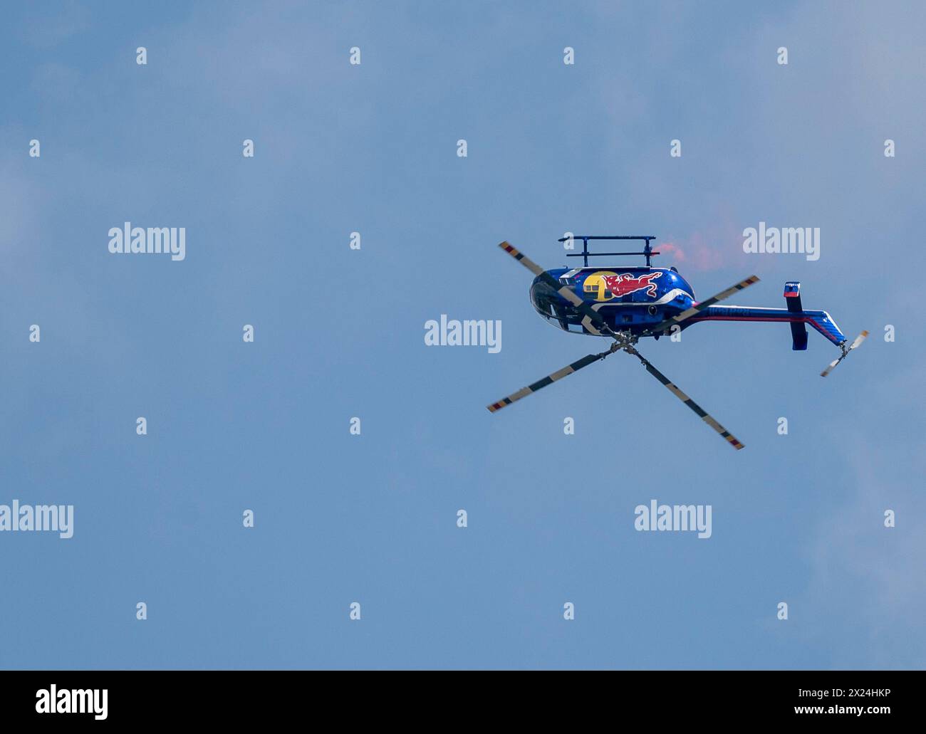A Red Bull Air Force helicopter performs an aerial maneuver during the ...