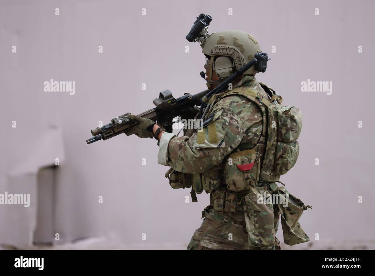 A Green Beret assigned to 5th Special Forces Group (Airborne) maneuvers ...