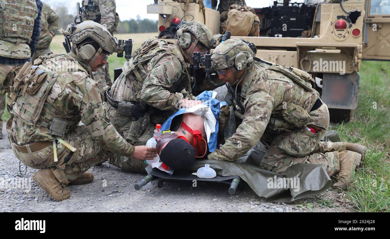 Green Berets assigned to 5th Special Forces Group (Airborne) treat a ...