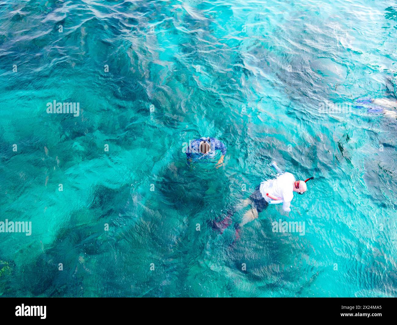 Aerial photograph of two people snorkeling near Fort Morgan Island ...