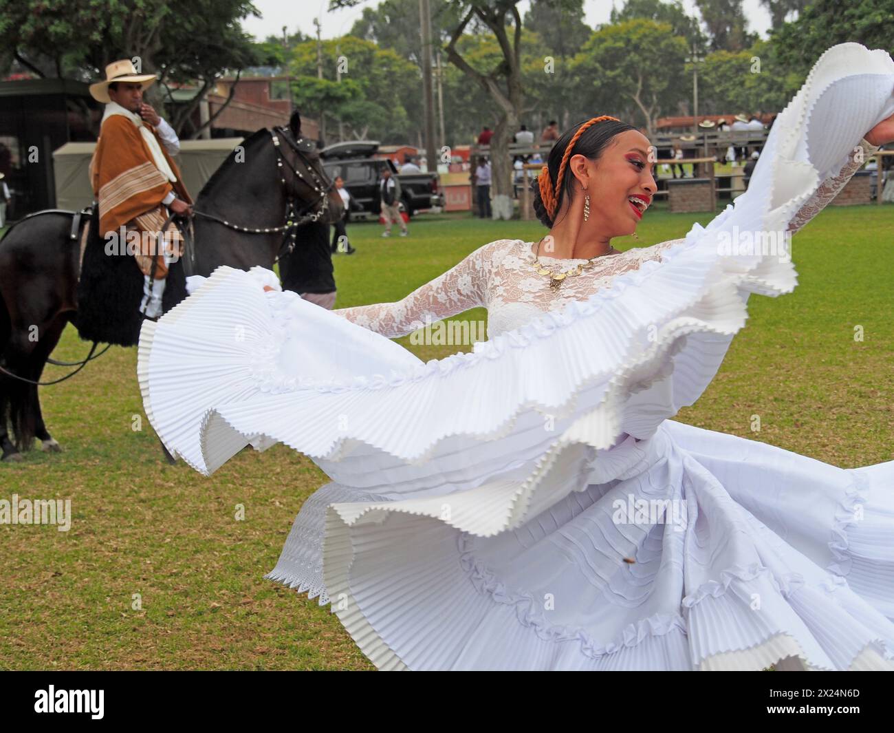Creole woman in typical costume dancing “Marinera”, a traditional dance ...