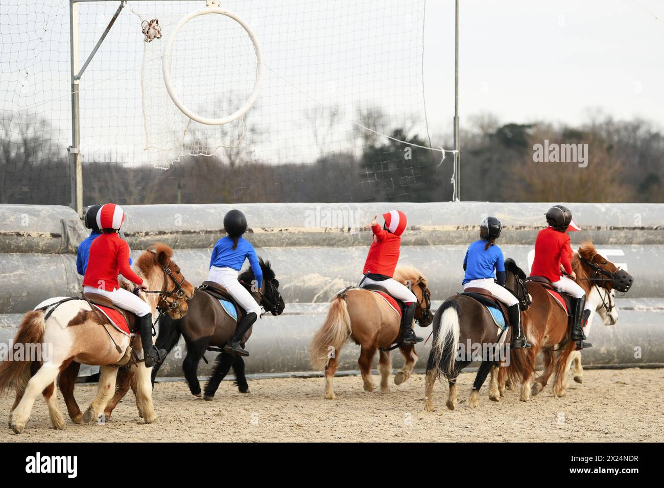 Children on ponys playing horseball Stock Photo - Alamy