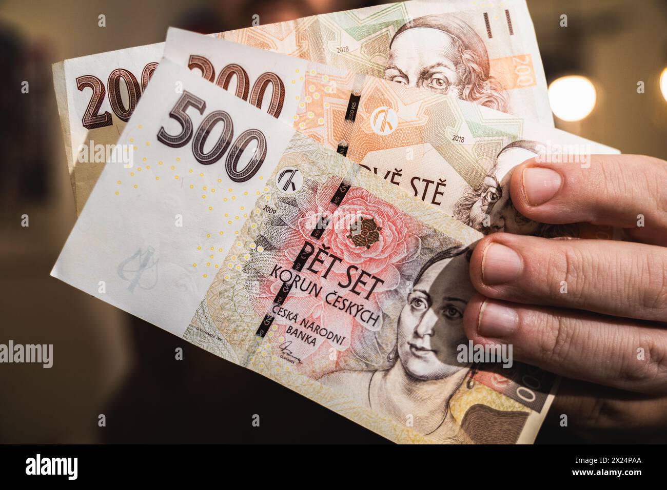Man holding a czech banknote hi-res stock photography and images - Alamy