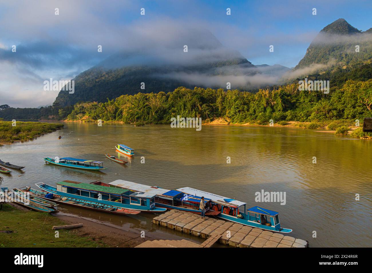 MUANG NGOI NEUA, LAOS - NOVEMBER 26, 2019: Boats at Nam Ou river in ...