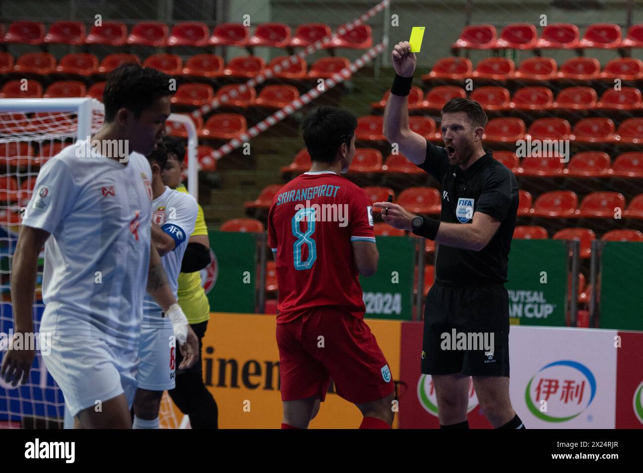 Bangkok, Bangkok, Thailand. 19th Apr, 2024. The referee gives a yellow ...