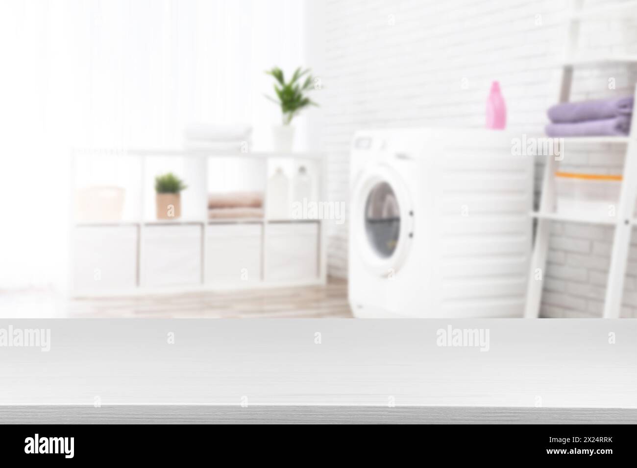 Empty white wooden table in laundry room. Space for design Stock Photo ...
