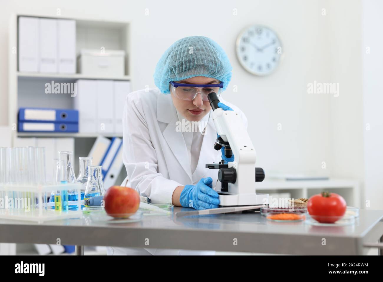 Quality control. Food inspector checking safety of products in ...