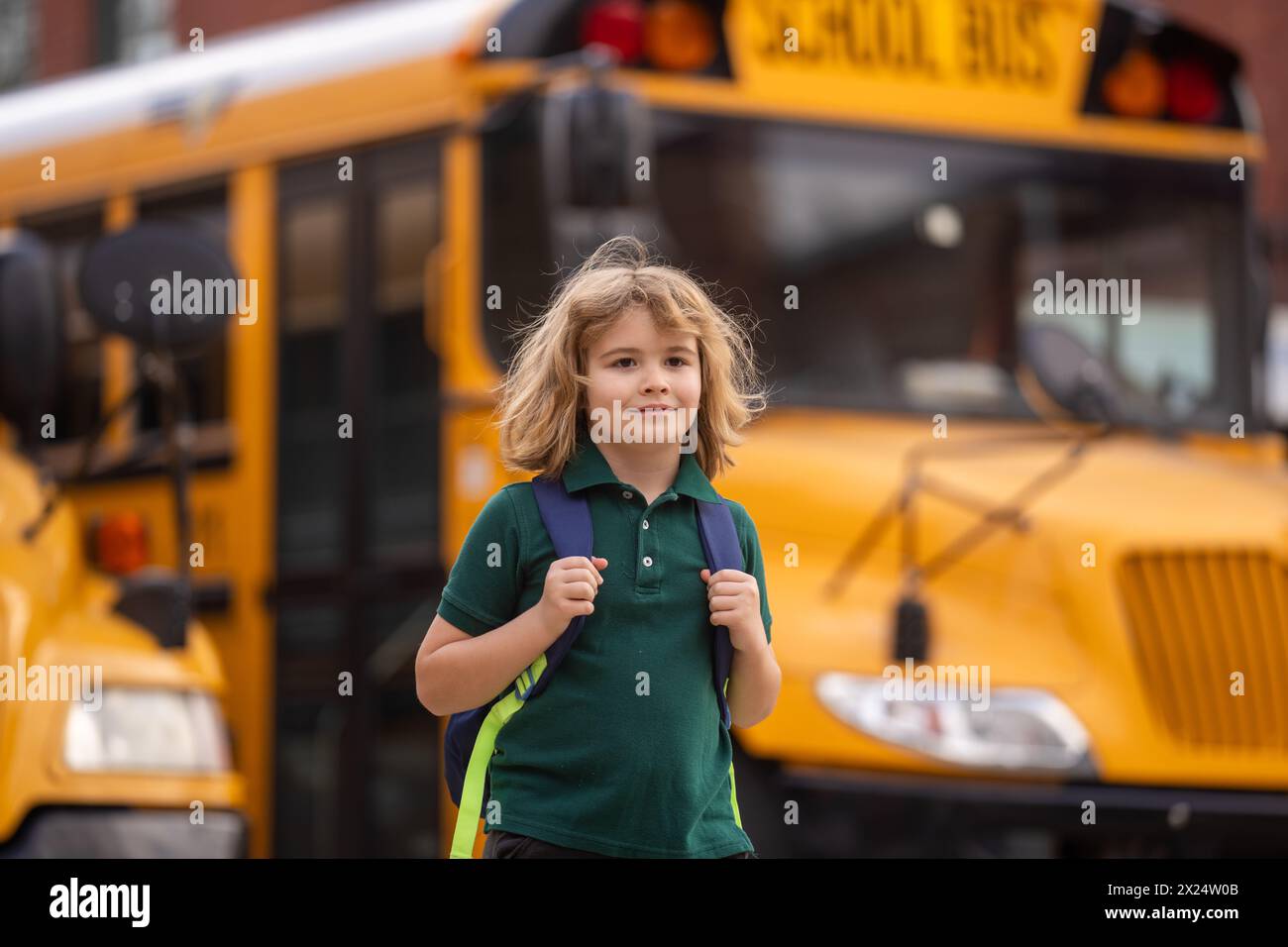 Schoolchild getting on the school bus. American School. Back to school ...
