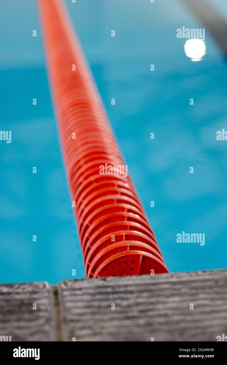 Red lane dividers stretching across a blue swimming pool indoors Stock ...