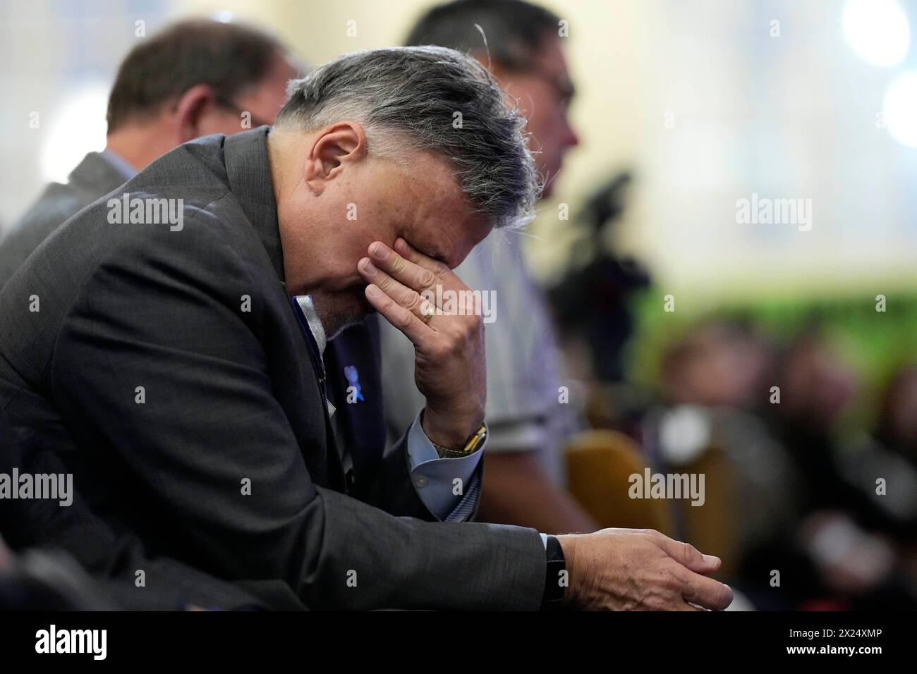 Columbine High School principal Frank DeAngelis reacts during a vigil ...