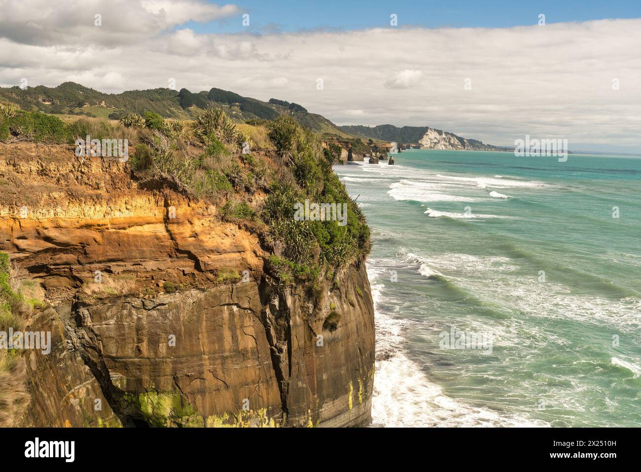 Pillars of rock rising from the sea on the Taranaki coastline Stock ...