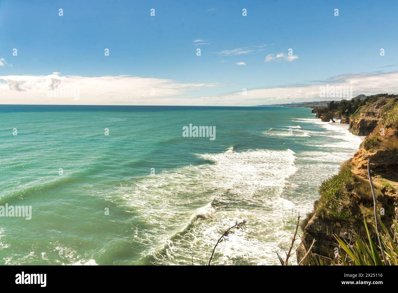 Pillars of rock rising from the sea on the Taranaki coastline Stock ...