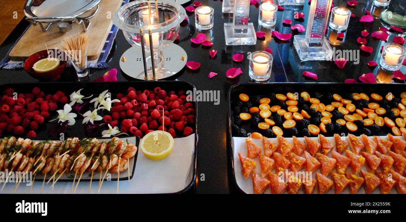 Festive cocktail reception hors d'oeuvre buffet table in New York, USA ...