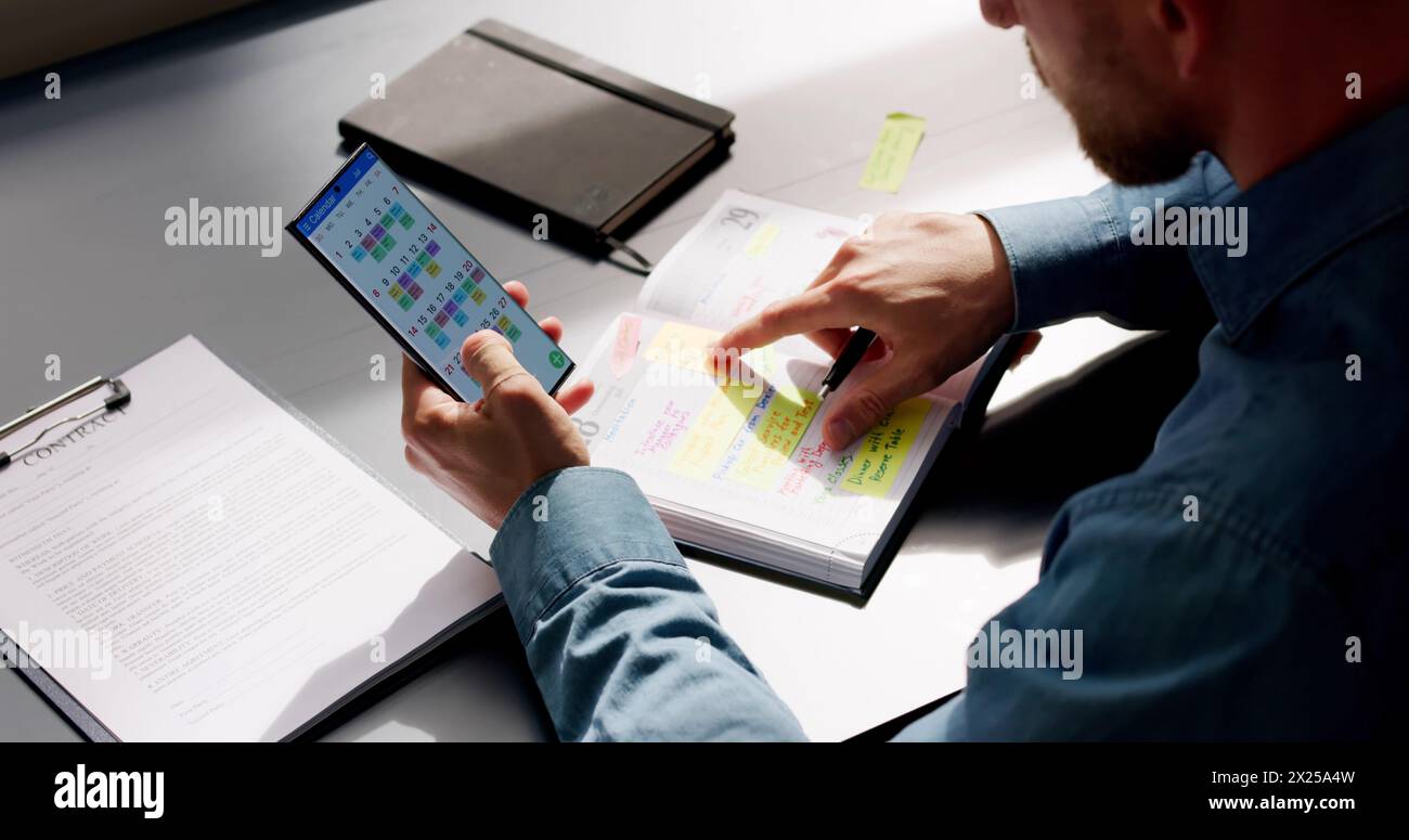 Calendar Schedule List At Desk And In Mobile Phone Stock Photo - Alamy