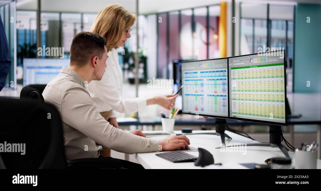 Analyst Employee Working On Spreadsheet Using Desktop Computer Stock ...