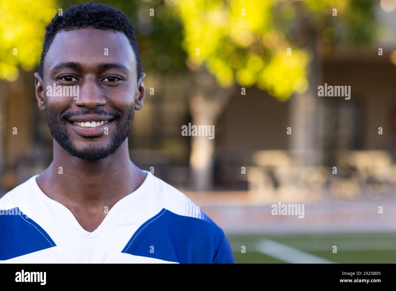 African American young male athlete and fitness model, wearing sporty ...