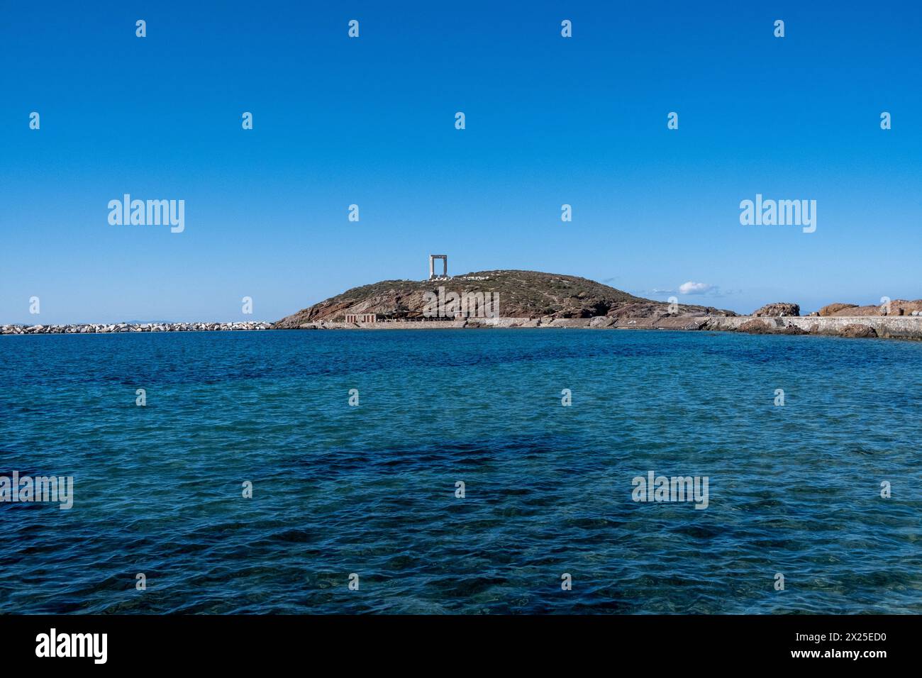 Temple of Apollo, also known as Portara, on a peninsula in the town of ...