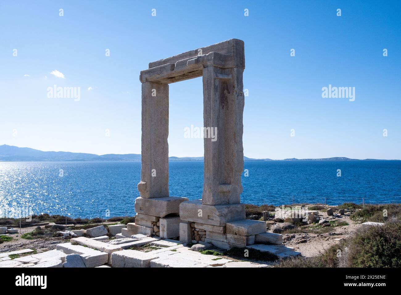 Temple of Apollo, also known as Portara, on a peninsula in the town of ...