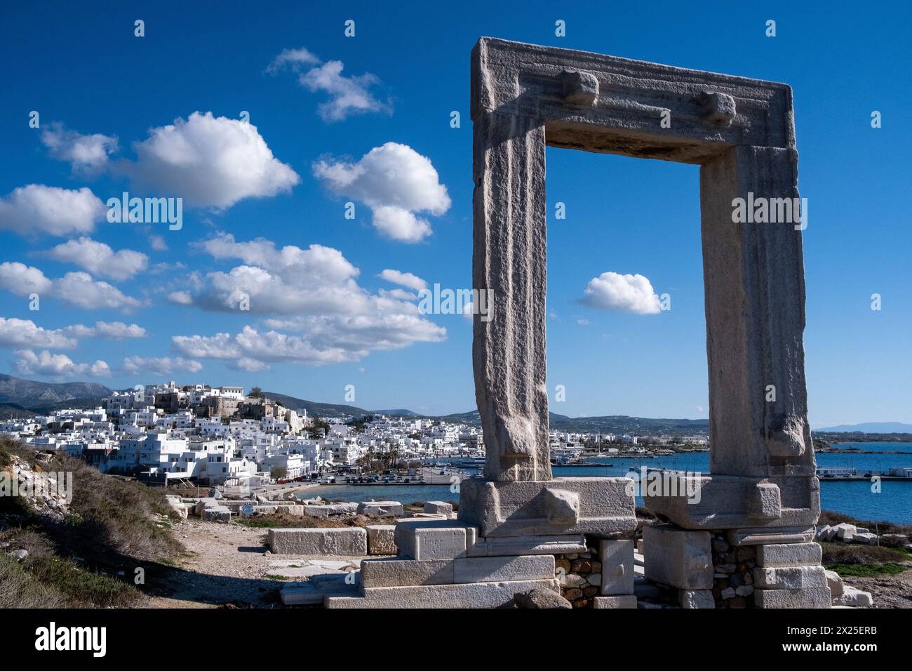 Temple of Apollo, also known as Portara, on a peninsula in the town of ...