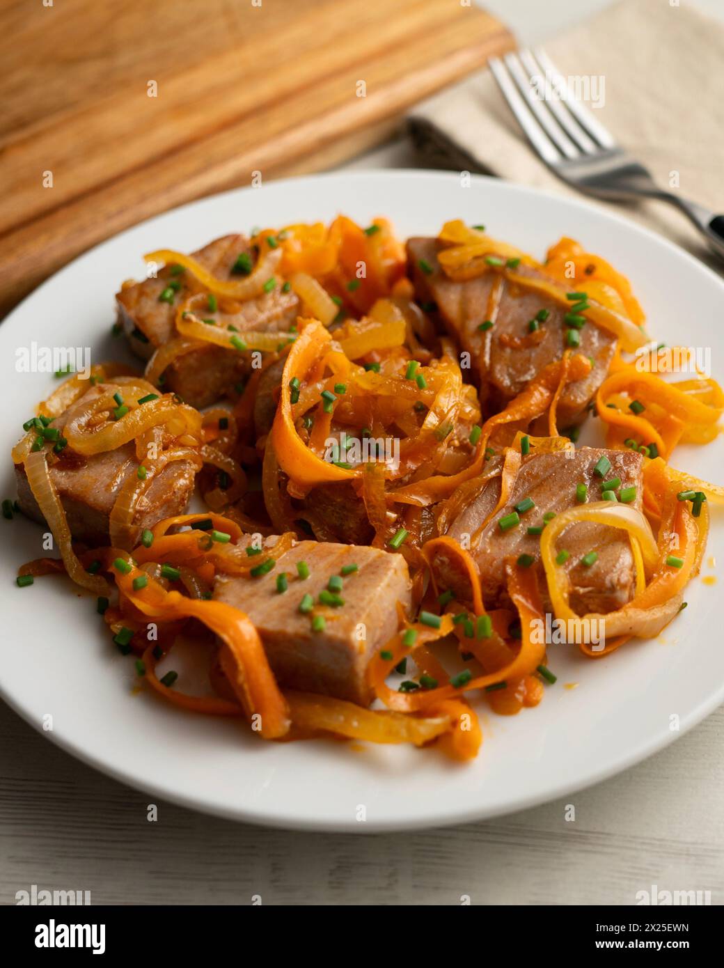 Atun encebollado. Traditional spanish tapa with premium tuna cooked ...