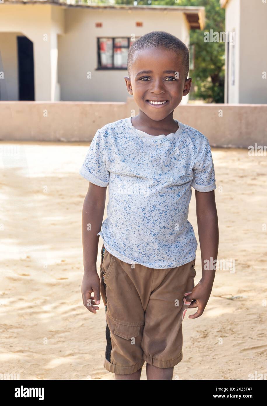 village african child ,standing in the yard, casual dressed Stock Photo ...