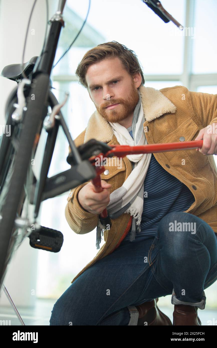happy man tries to get his bike Stock Photo - Alamy