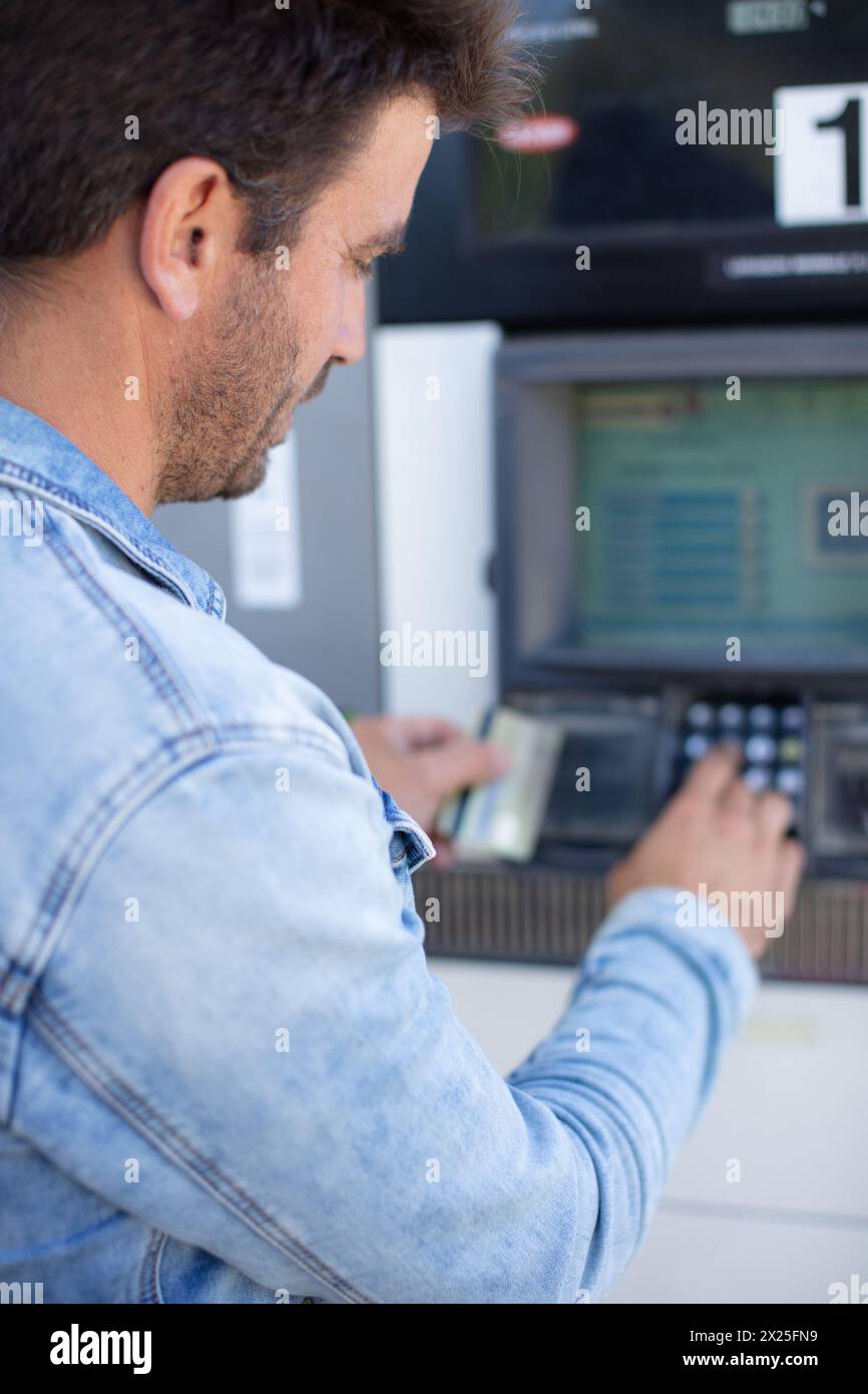 Taking cash from atm hi-res stock photography and images - Alamy