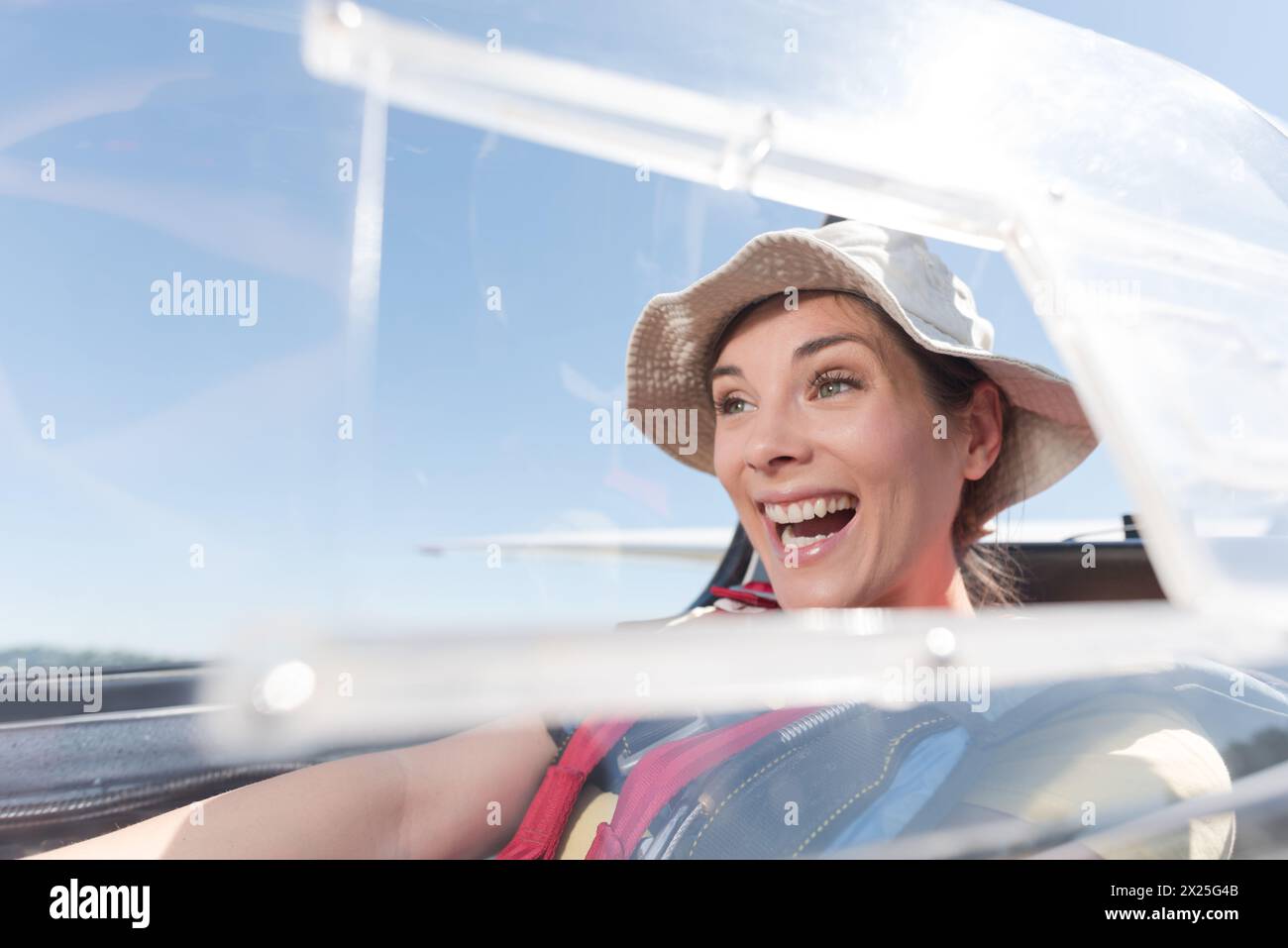 Female pilot smiling in cockpit hi-res stock photography and images - Alamy