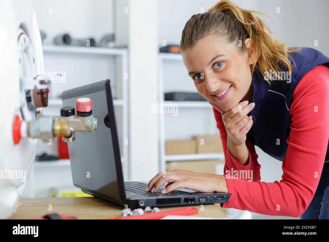 a female worker using laptop Stock Photo - Alamy