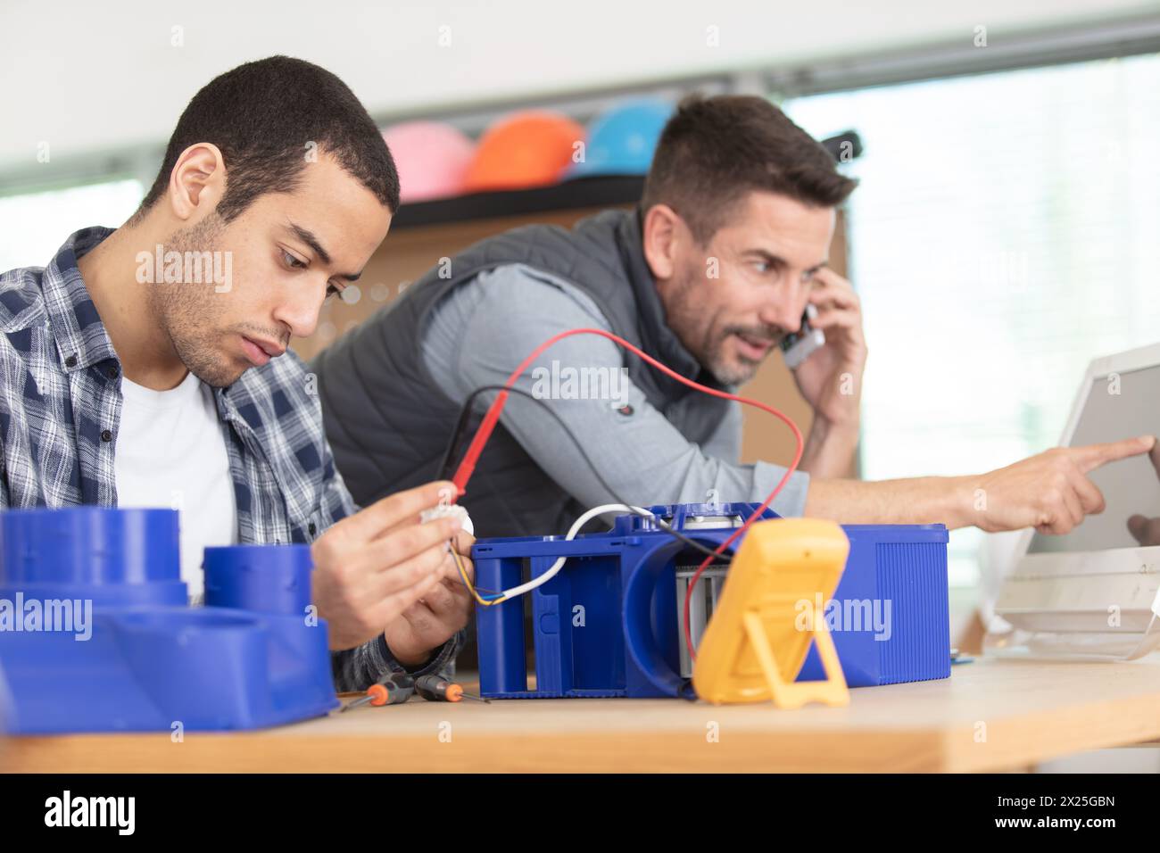 engineers assemble ventilation system in workshop Stock Photo - Alamy