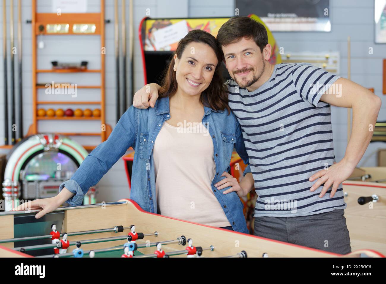 woman and man next to table football Stock Photo - Alamy