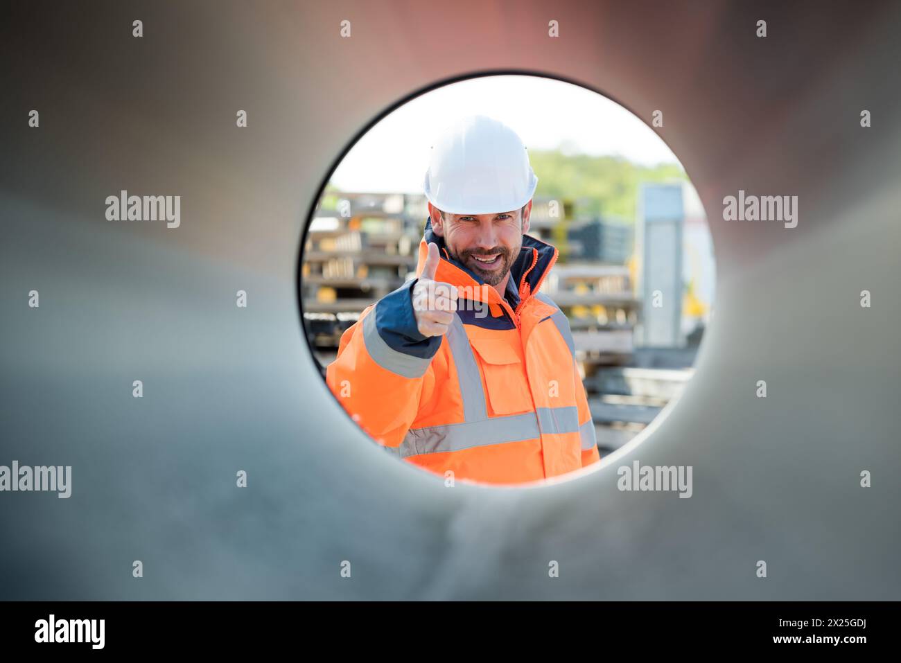 portrait of factory pipe worker with thumb up Stock Photo - Alamy