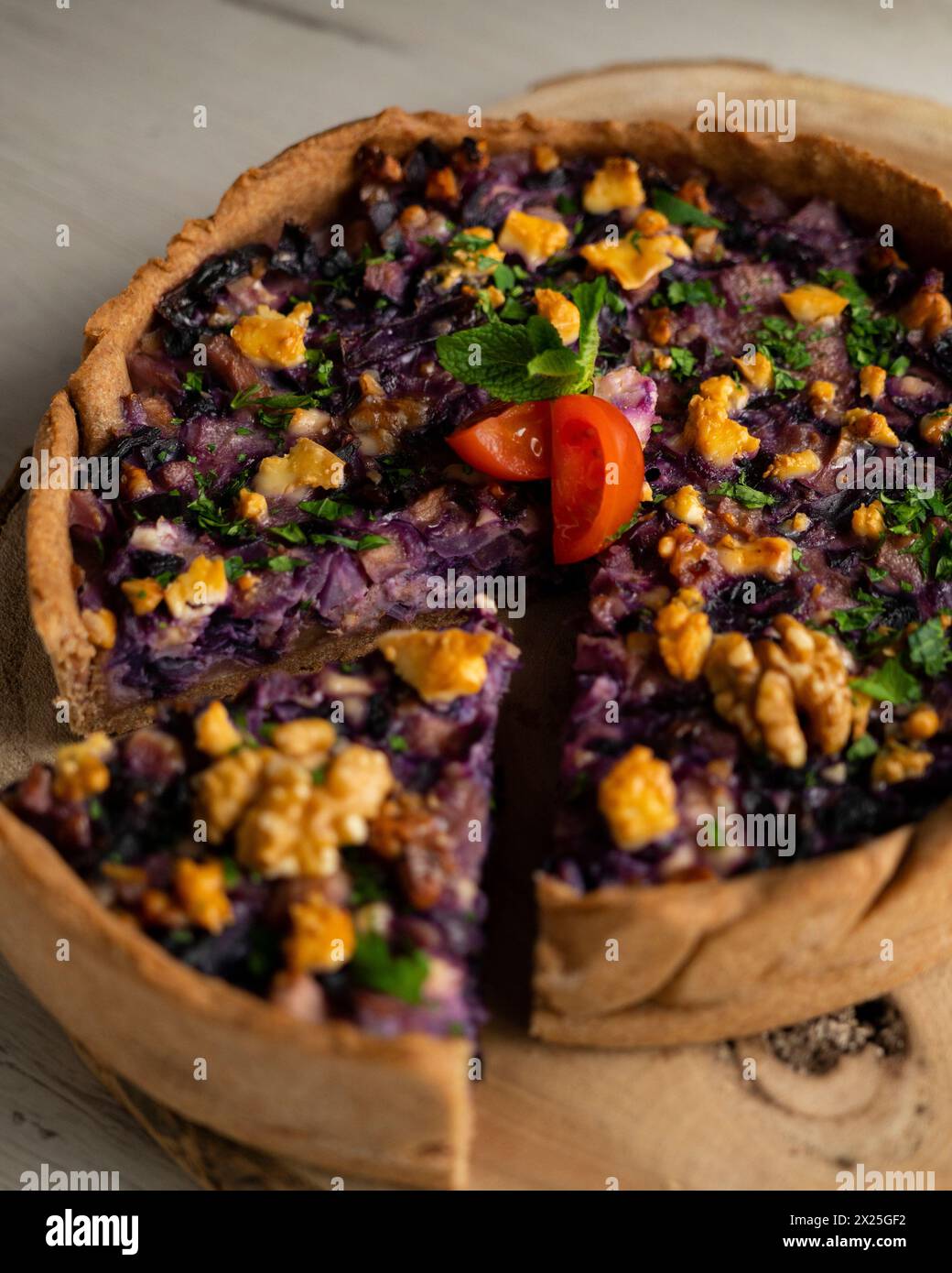 French quiche with red cabbage and vegetables. Traditional French ...