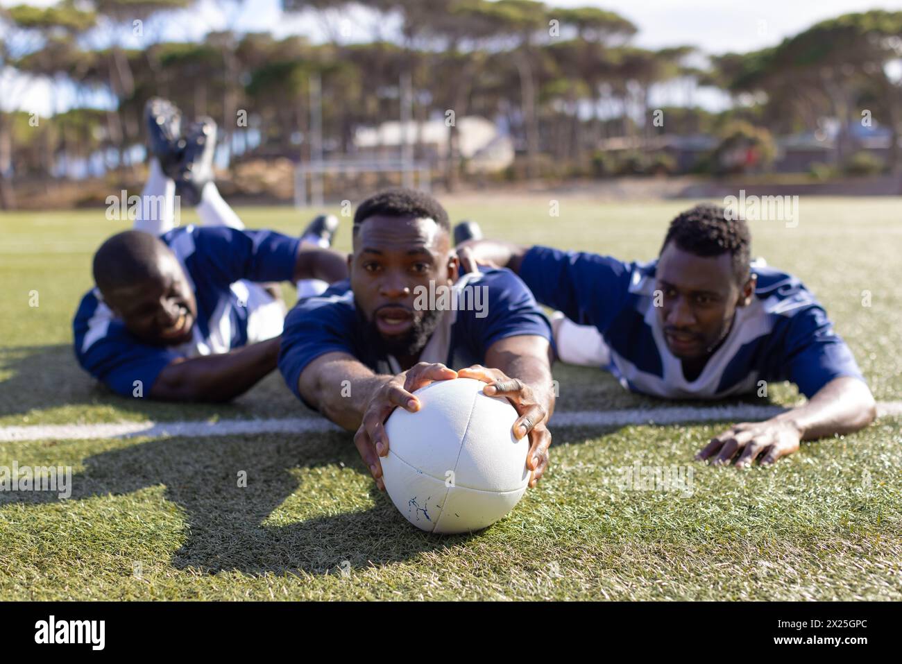 Three male athletes performing hi-res stock photography and images - Alamy
