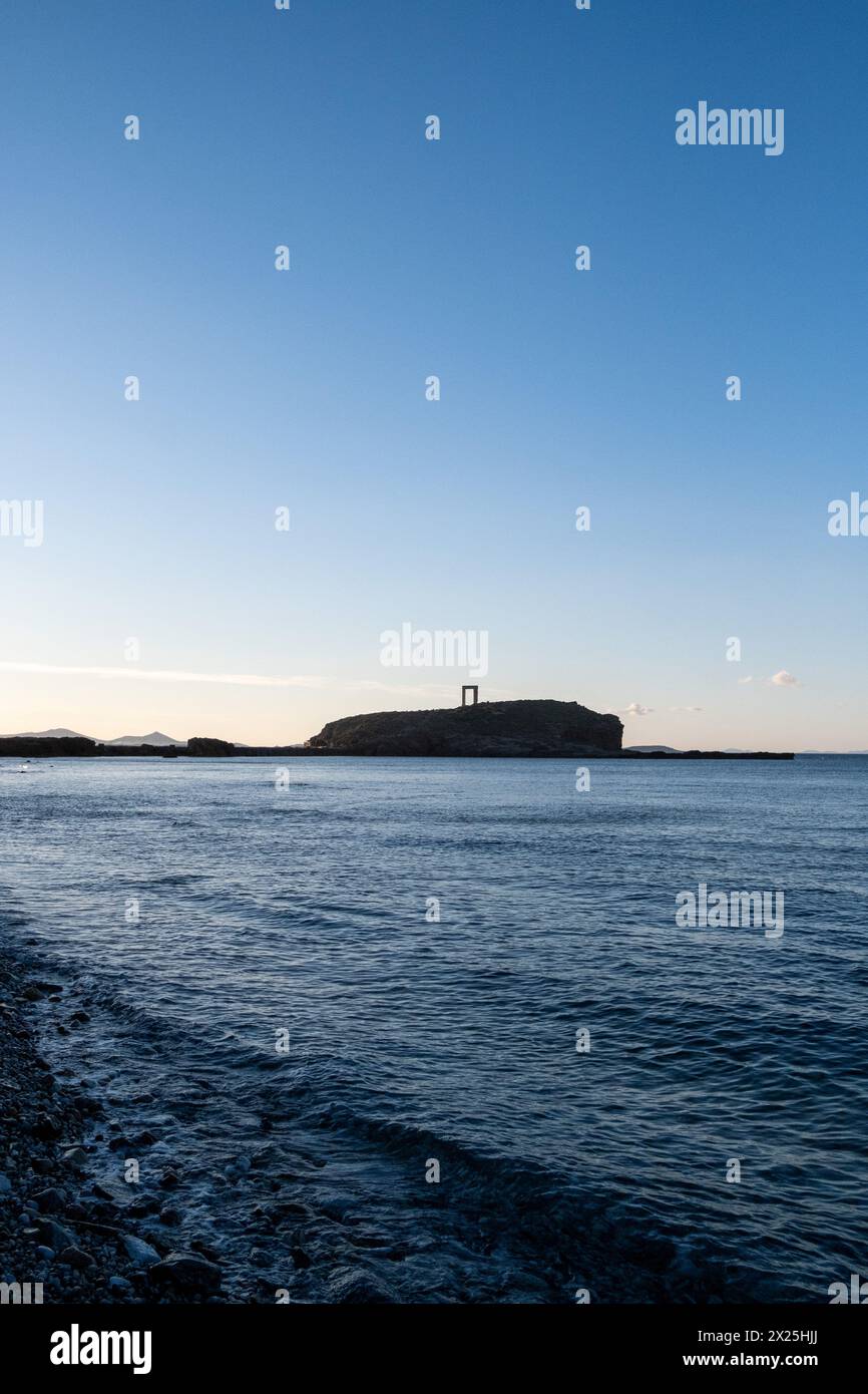 Temple of Apollo, also known as Portara, on a peninsula in the town of ...