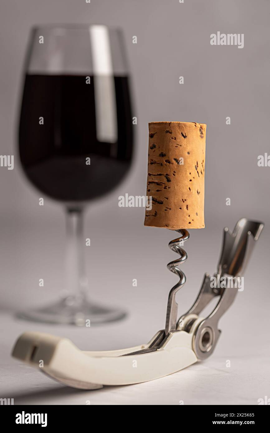 Macro photography of red wine; wineglass; cork; corkscrew; winery ...