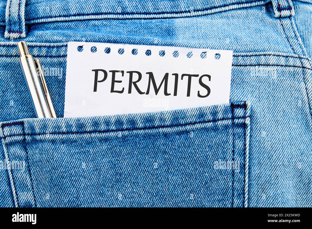 A word PERMITS on a piece of paper that appeared from the pocket of ...