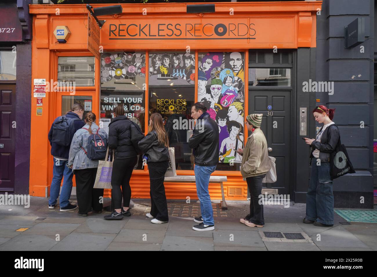 London 20 April 2024 . People queuing outside Reckless records in Soho on Record Stpore Day. to ...