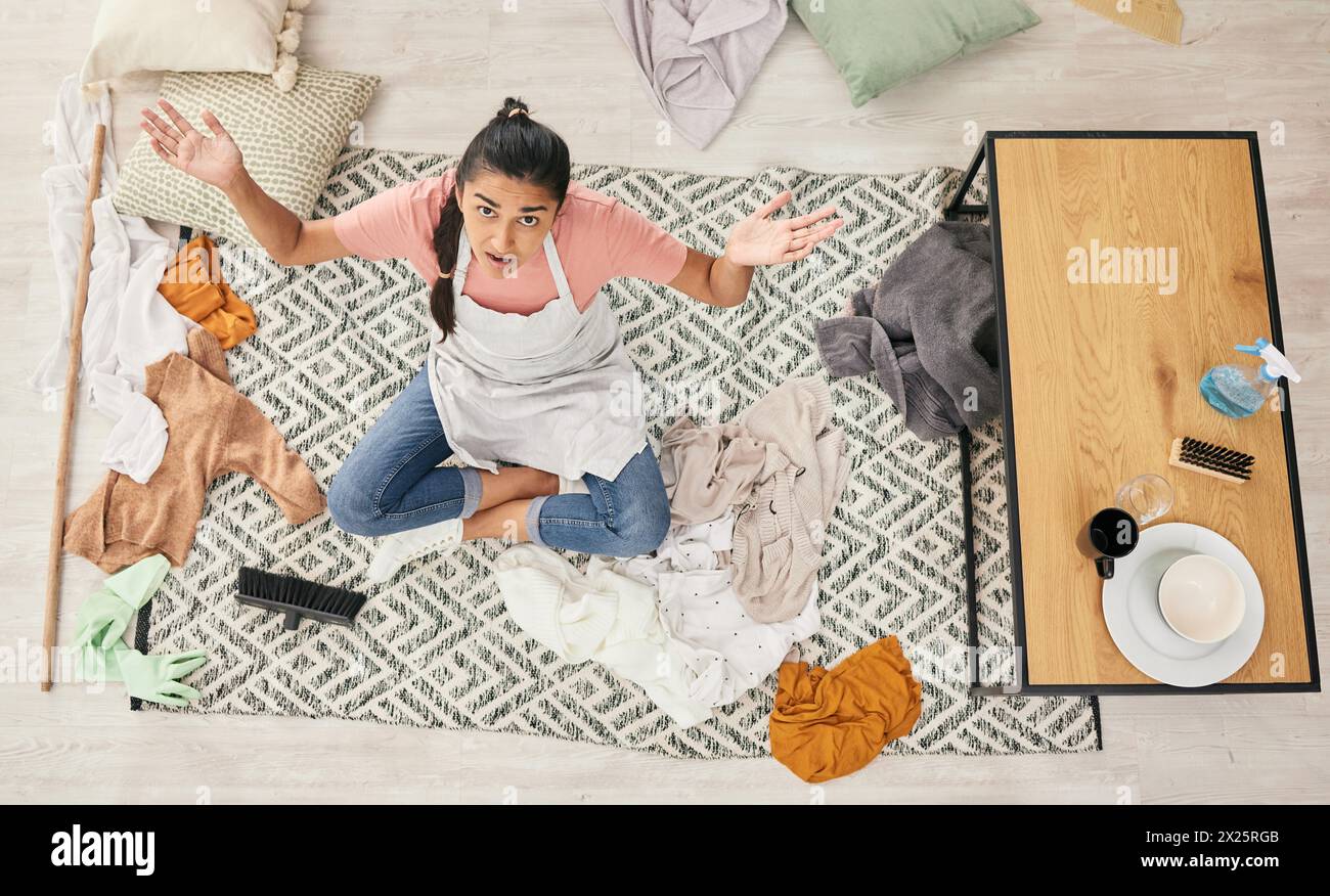 Woman, laundry and frustrated in messy living room with tired, house ...