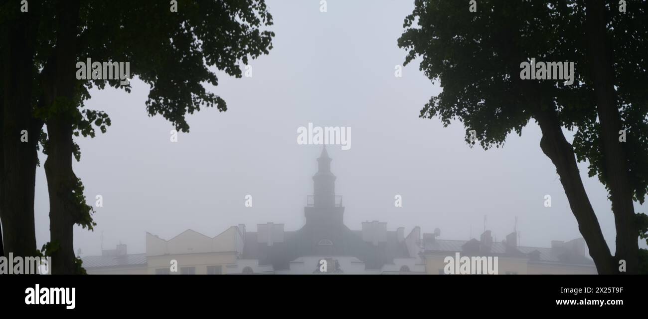 In the misty morning haze; the tower of Krasnystaw's town hall emerges ...