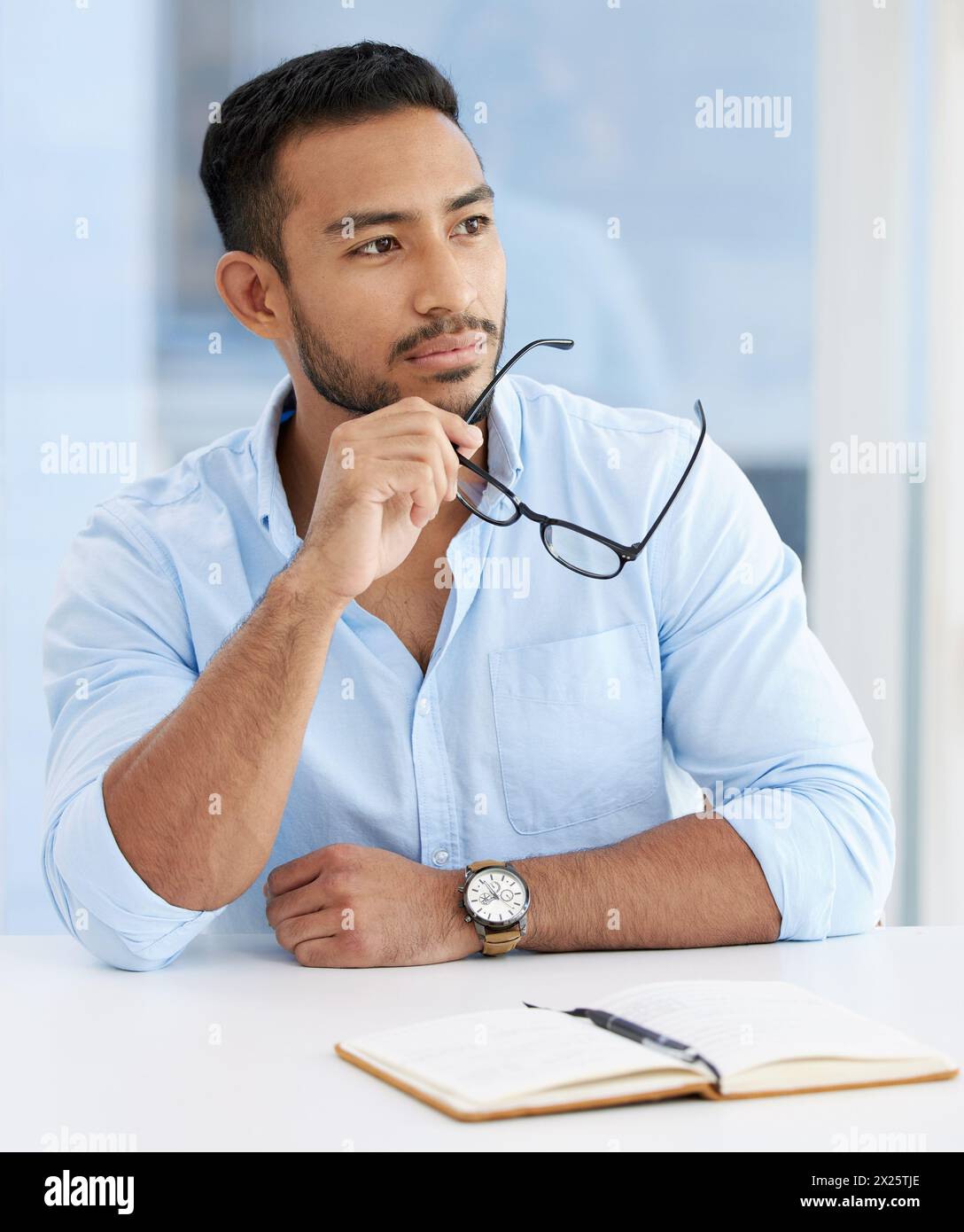 Man, glasses and thinking for ideas with notebook, journalist search ...