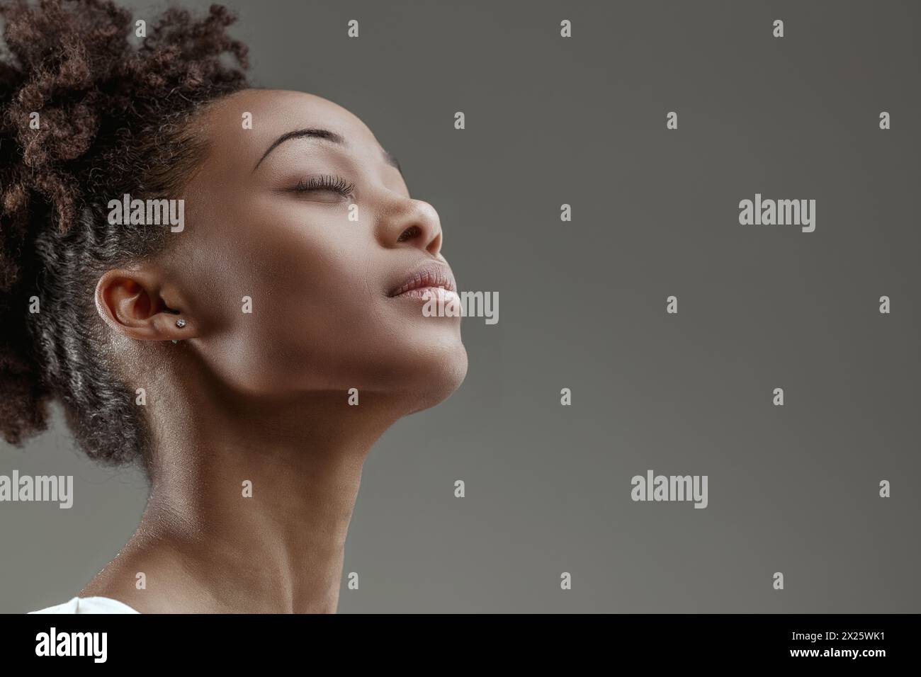 Woman with the head tilted hi-res stock photography and images - Alamy