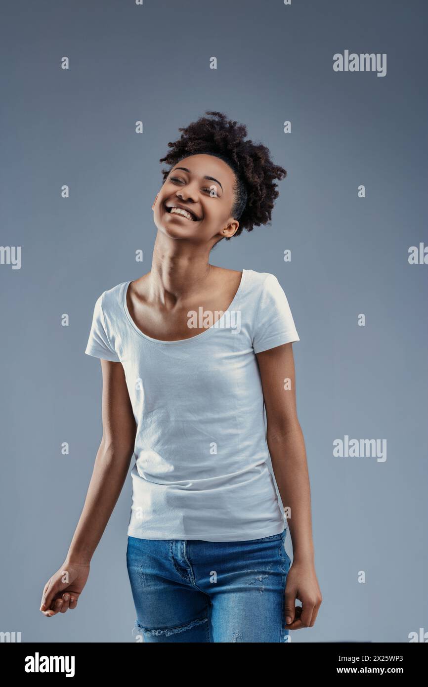 Radiant young woman beams delight hi-res stock photography and images ...