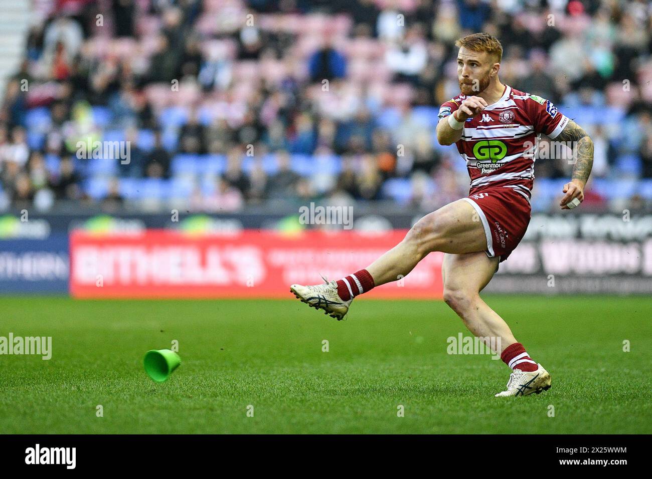Wigan, England - 19th April 2024 Adam Keighran of Wigan Warriors kicks. Rugby League Betfred ...