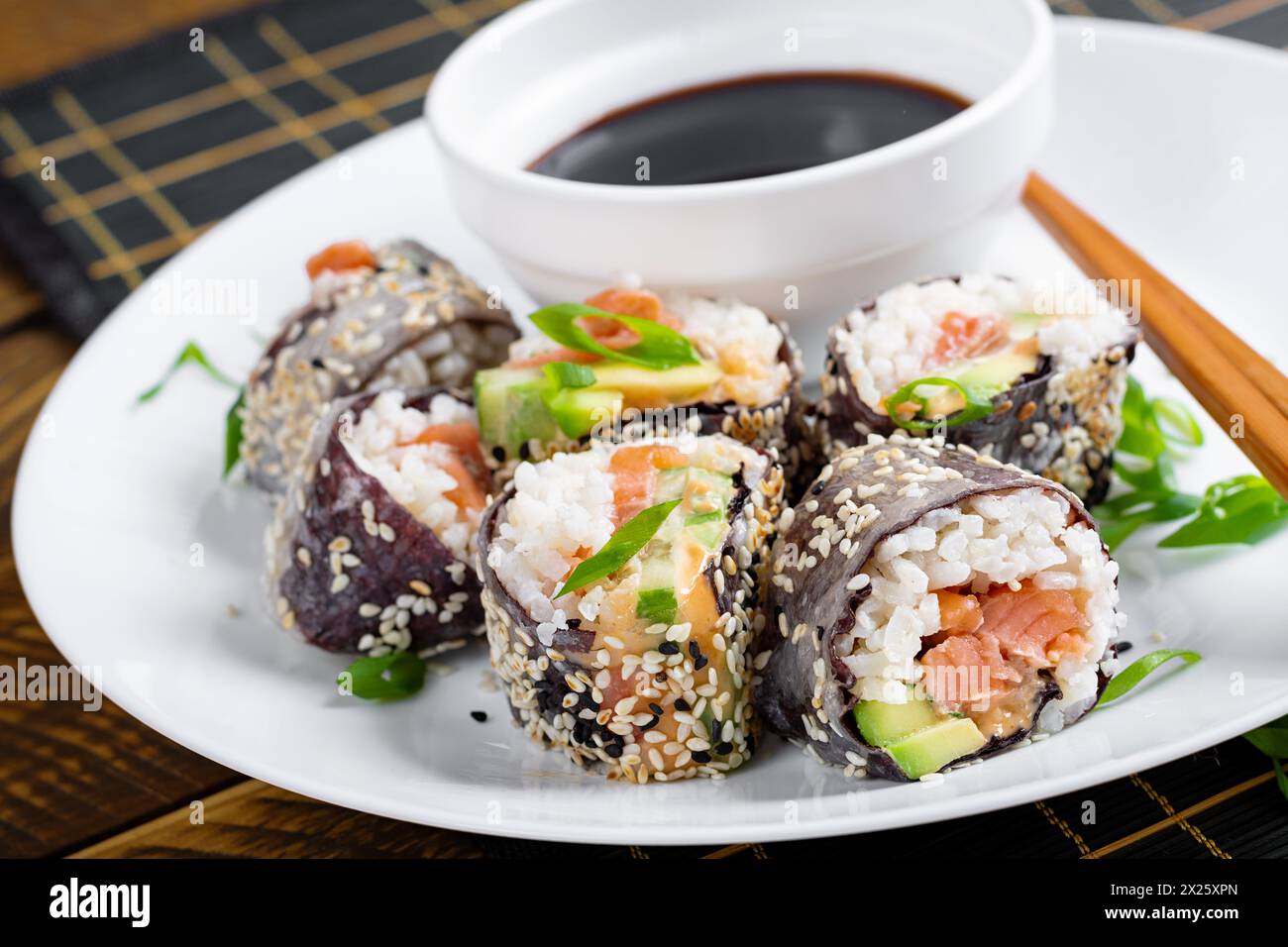 Spring roll with nori, sushi rice, salmon, cucumber and avocado ...