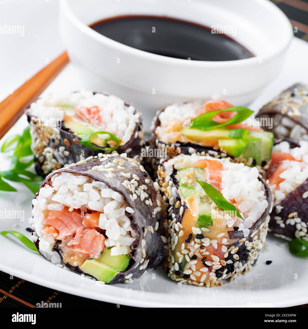 Spring roll with nori, sushi rice, salmon, cucumber and avocado ...